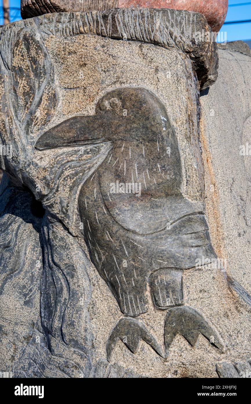 Stone carving of a raven perched at Inuit sculpture park by the Four ...