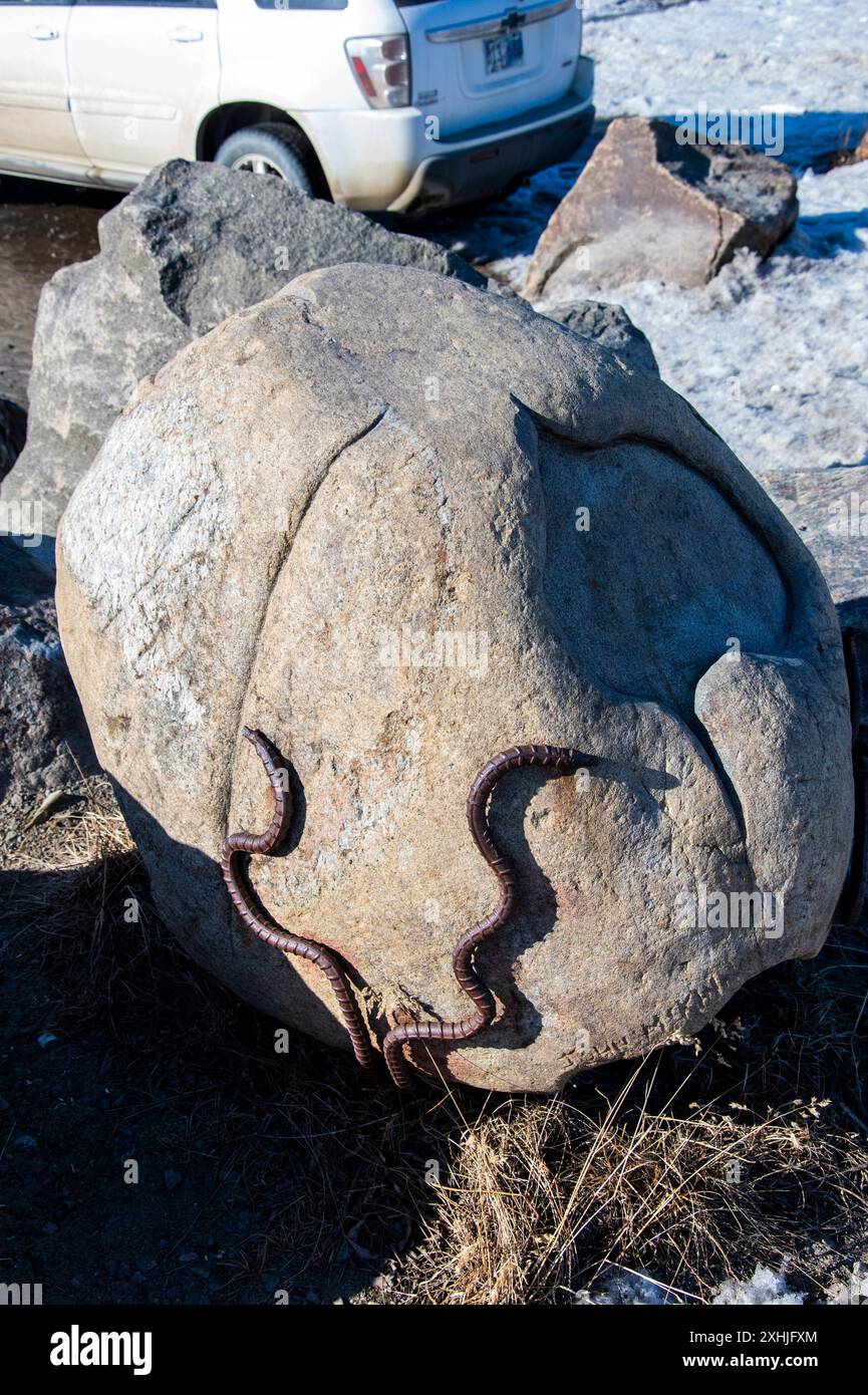 Stone carving of worms or snakes at Inuit sculpture park by the Four ...