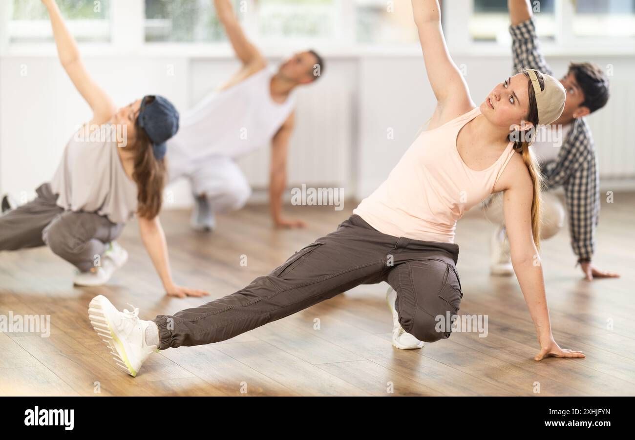 Young girl practicing breakdance floor-works in training hall Stock ...
