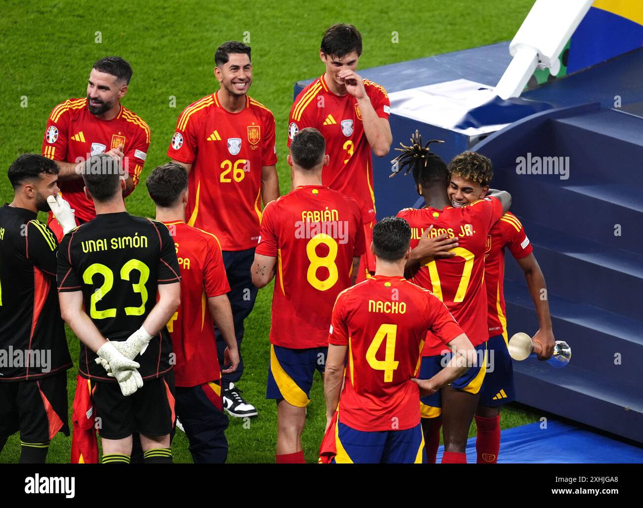 Spain's Lamine Yamal (right) with the trophy for best young player of ...