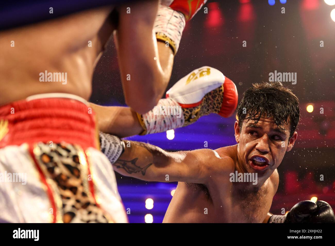 July 13, 2024: (R) Javier Mayoral throws a punch during his ...