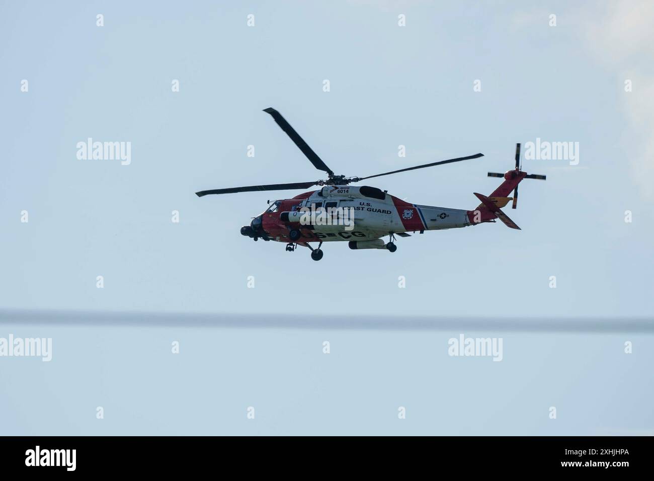 A U.S. Coast Guard helicopter flies over the Milwaukee Mitchell ...