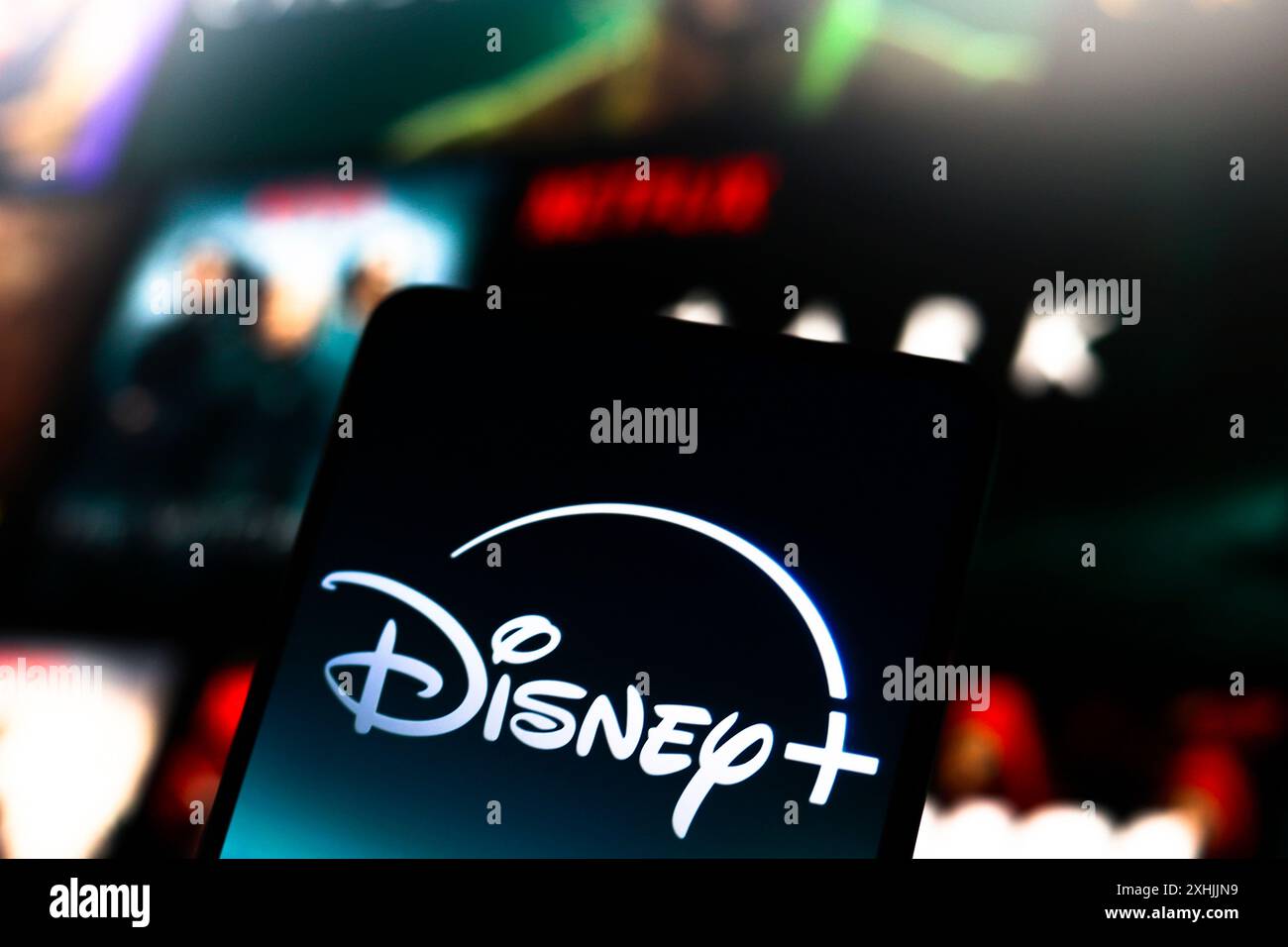 In this photo illustration, the Disney Plus logo is displayed on a ...
