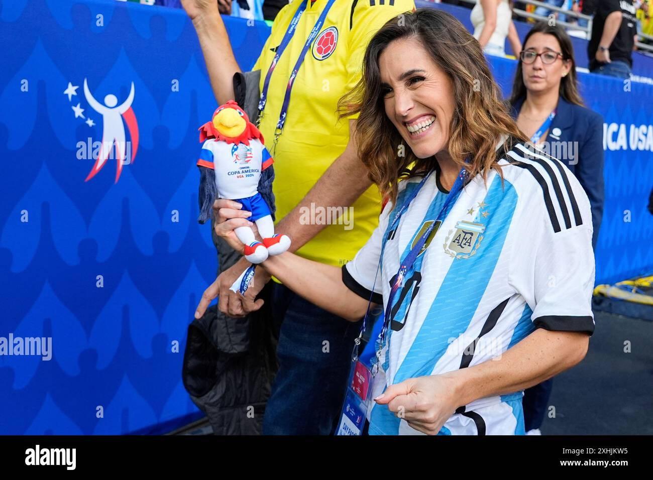 Argentine singer Soledad Pastorutti displays the Copa America mascot ...