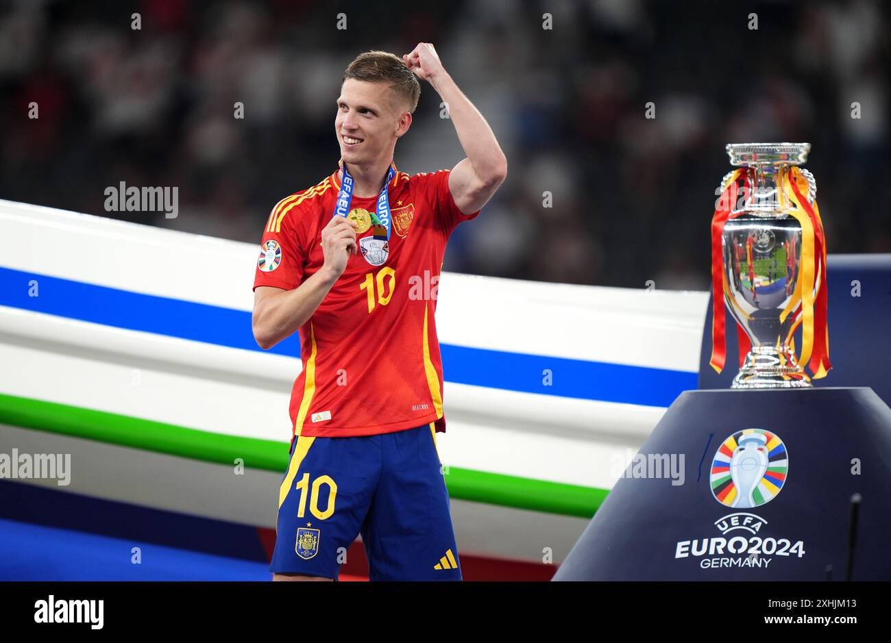 Spain's Dani Olmo celebrates next to the Henri Delaunay Cup after the ...