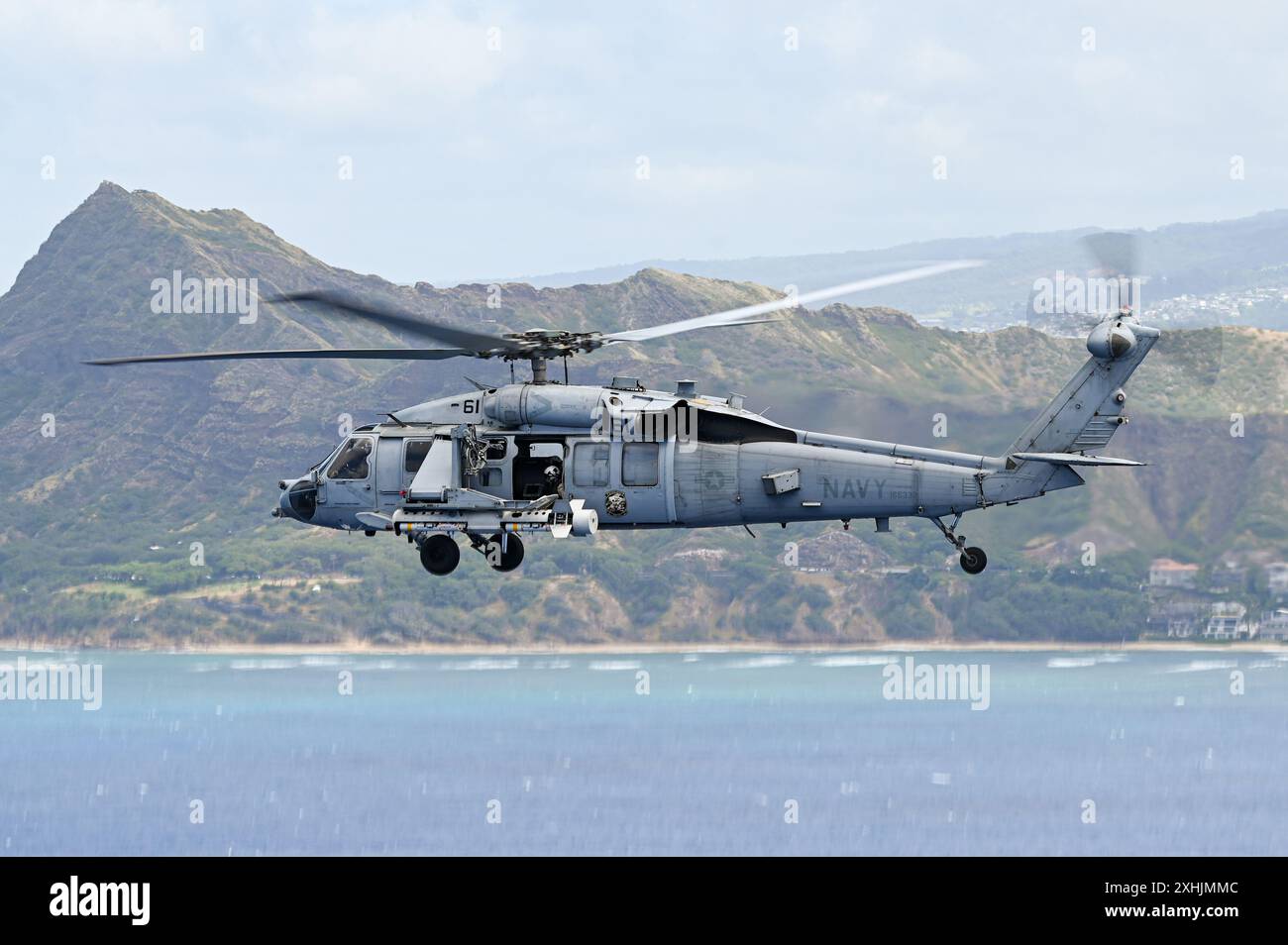 A U.S. Navy MH-60S Seahawk flies with an Airborne Mine Neutralization ...