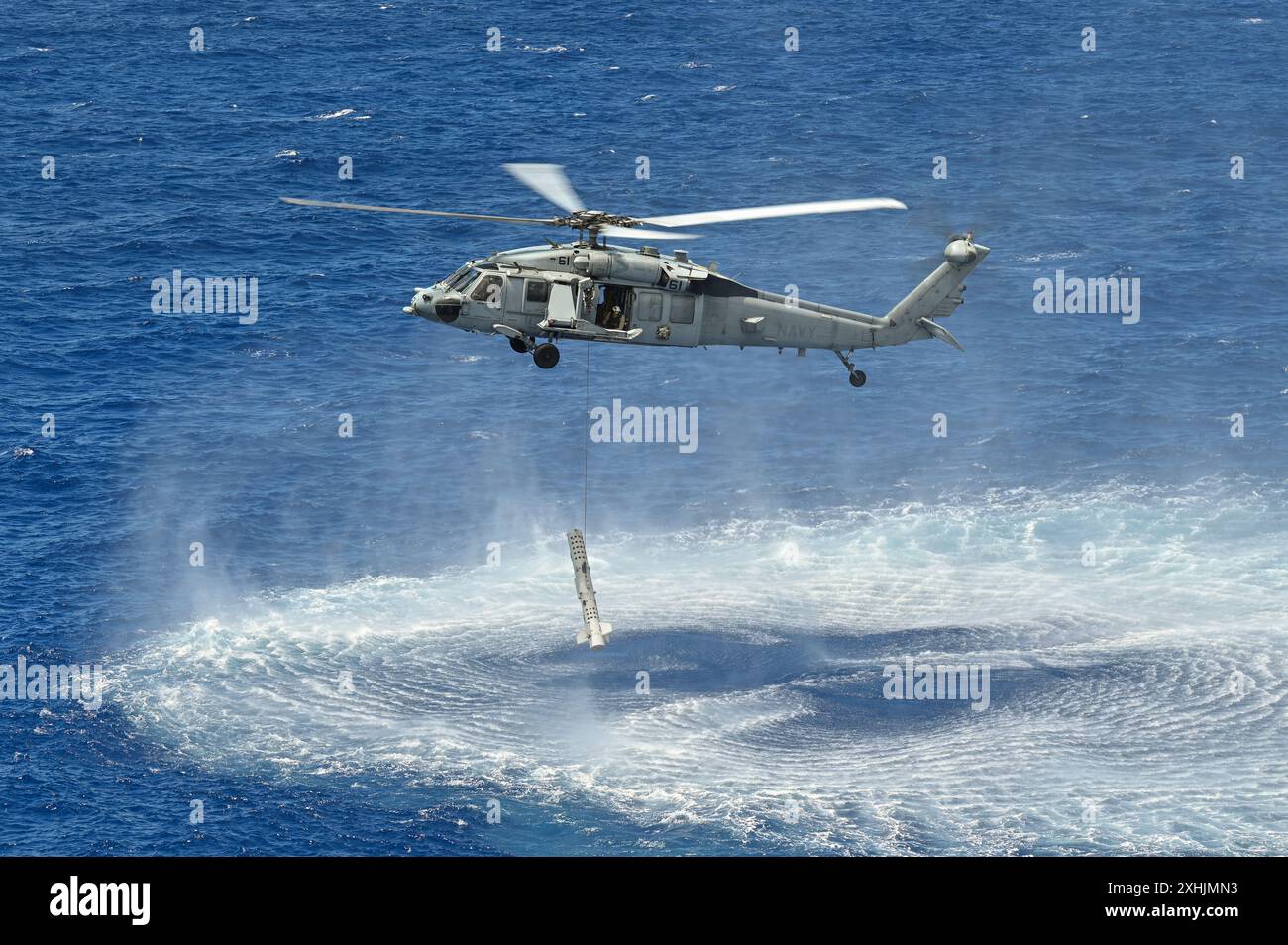 A U.S. Navy MH-60S Seahawk deploys an Airborne Mine Neutralization ...
