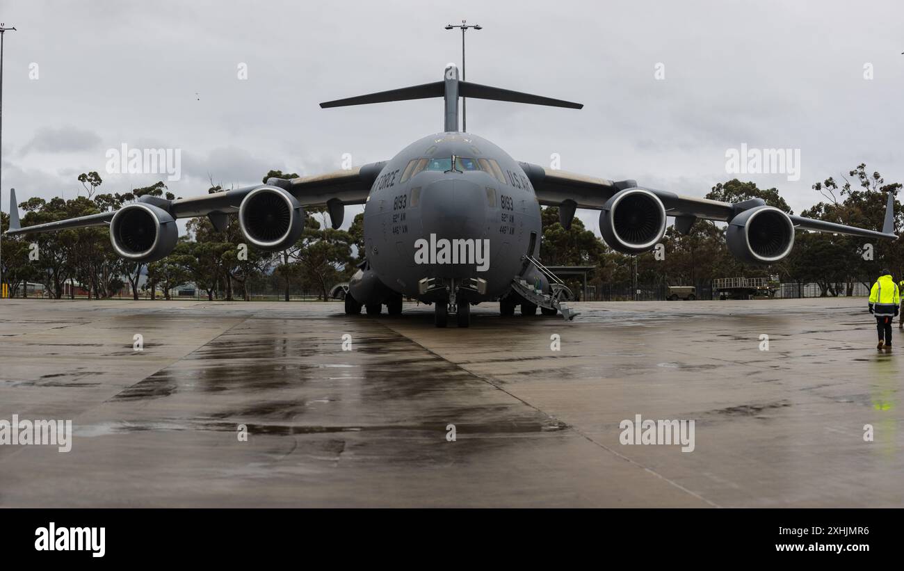 A U.S. Air Force C-17 Globemaster III assigned to 446th Airlift Wing transports U.S. Marines ...