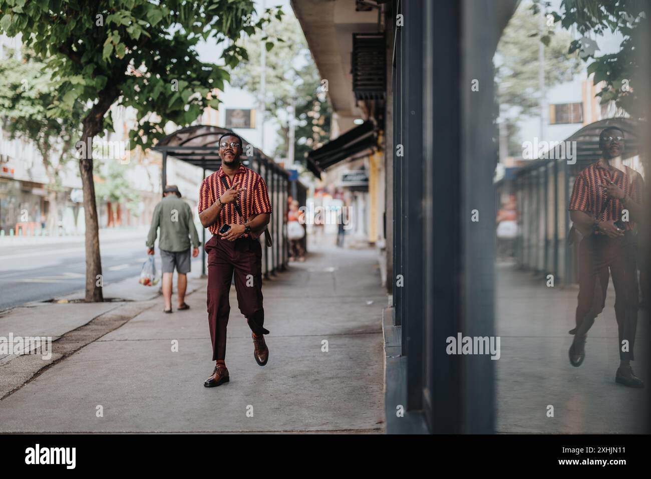 Urban street scene with stylish man walking and city life reflections ...