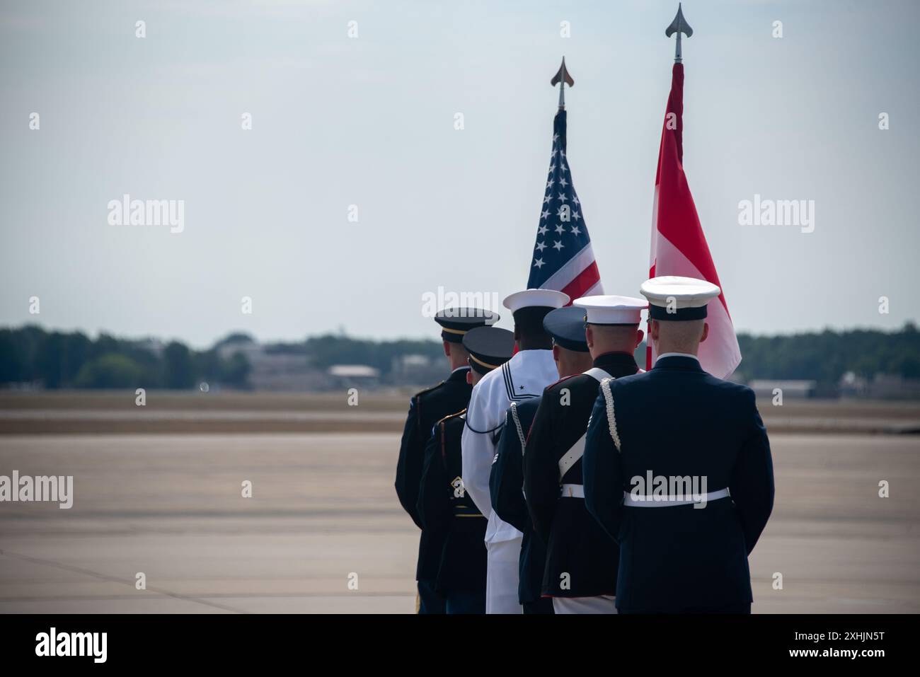 The Joint Armed Forces Color Guard stand in formation on the flight ...