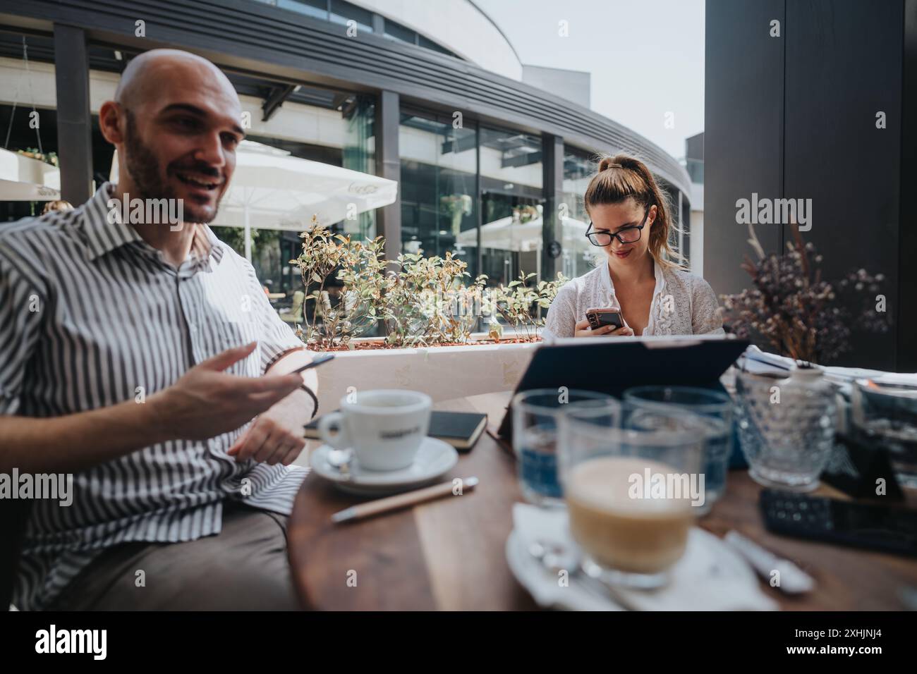 Startup team in business meeting at a cafe discussing ideas and ...