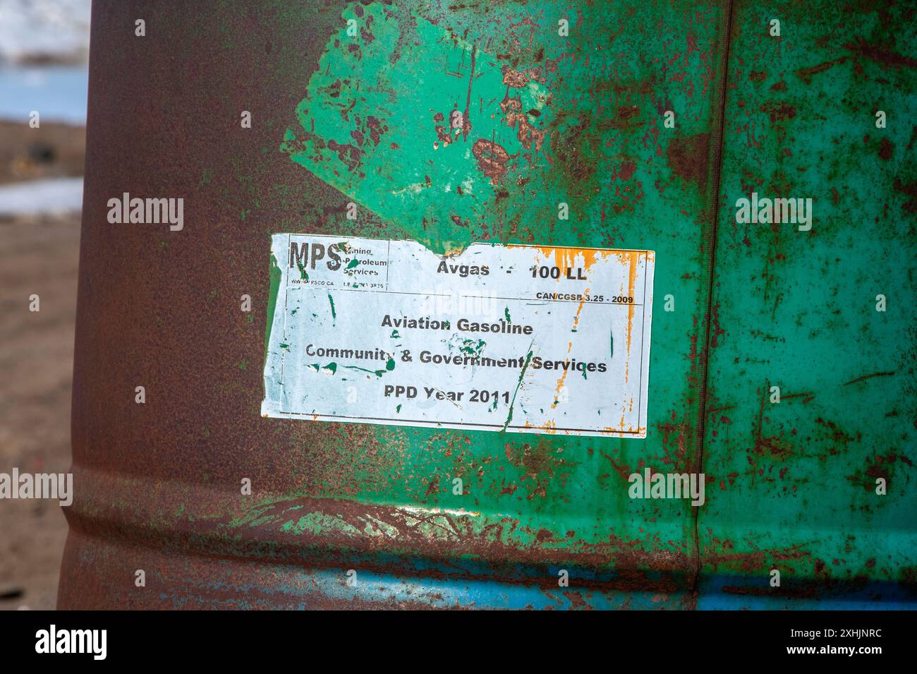 Label on the empty drum of aviation gasoline discarded on the beach on ...