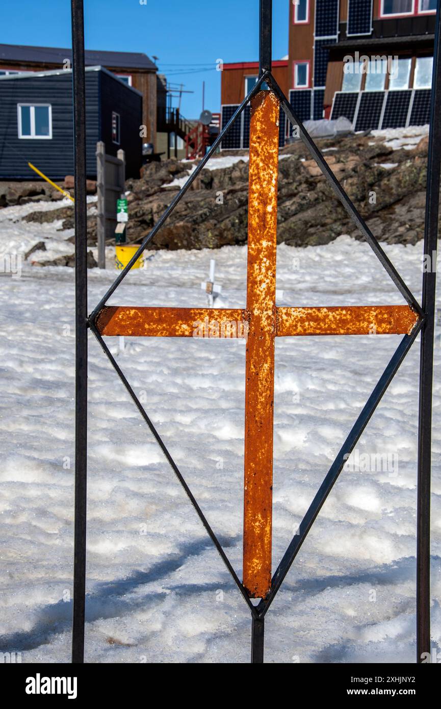 Cross on the iron gates at the Iqaluit Cemetery on Nipisa Street in ...