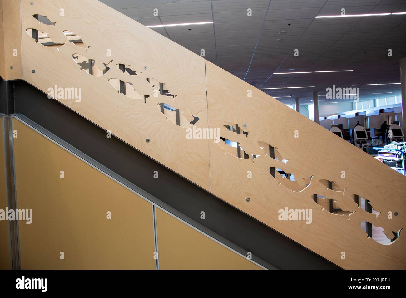 Cutouts of arctic char fish design on the railings of the stairs inside ...
