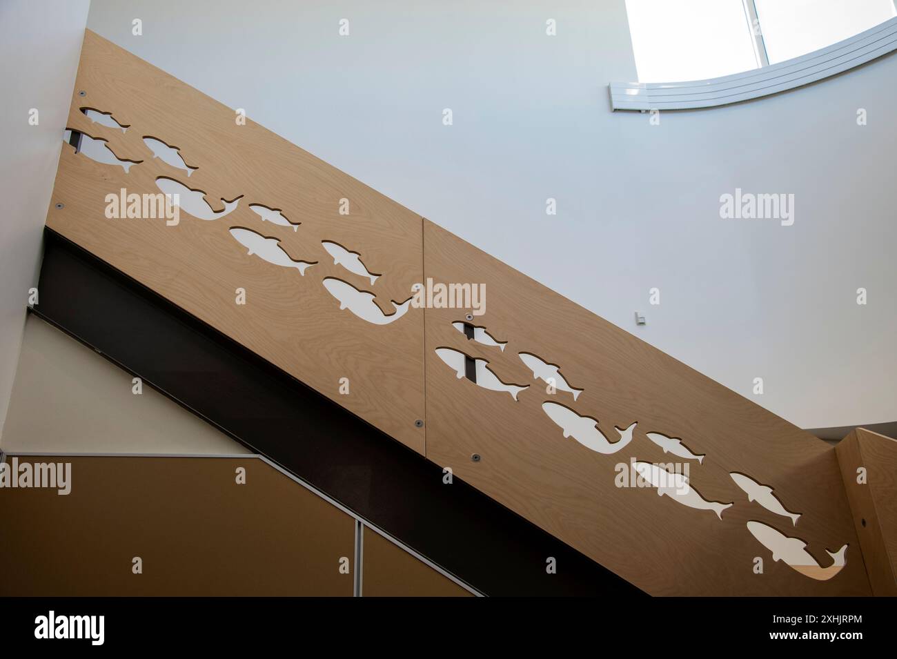 Cutouts of arctic char fish design on the railings of the stairs in ...