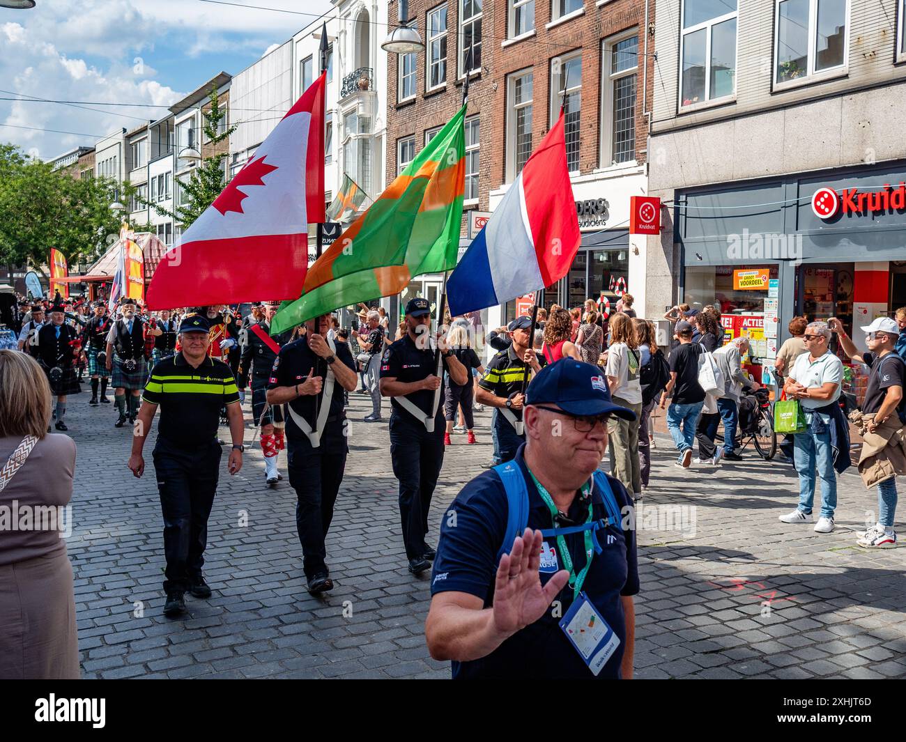 Participants are seen holding flags during the flag parade. Since then ...