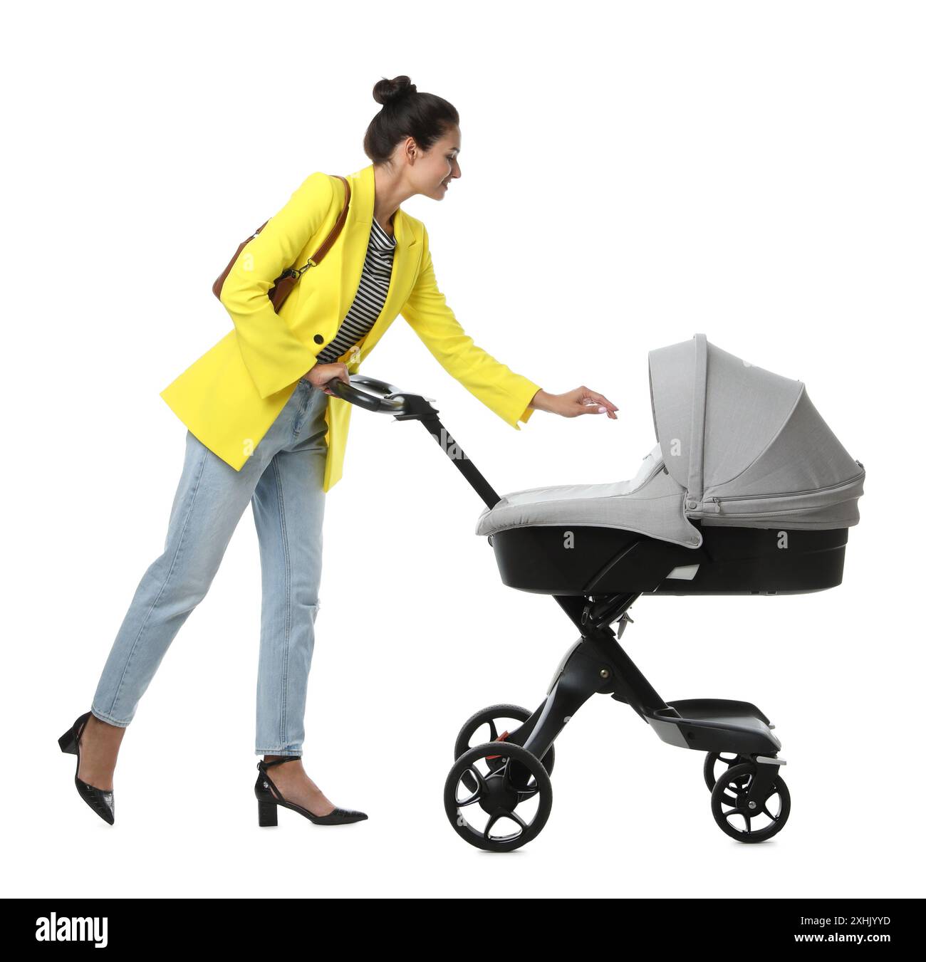 Happy young woman with baby stroller on white background Stock Photo ...