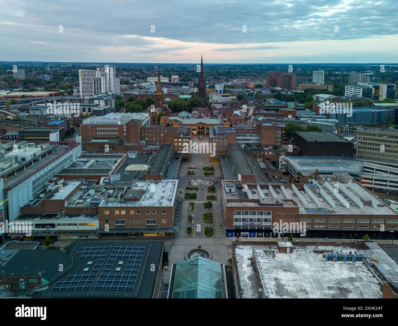 Coventry city centre skyline at dusk with buildings and streets ...