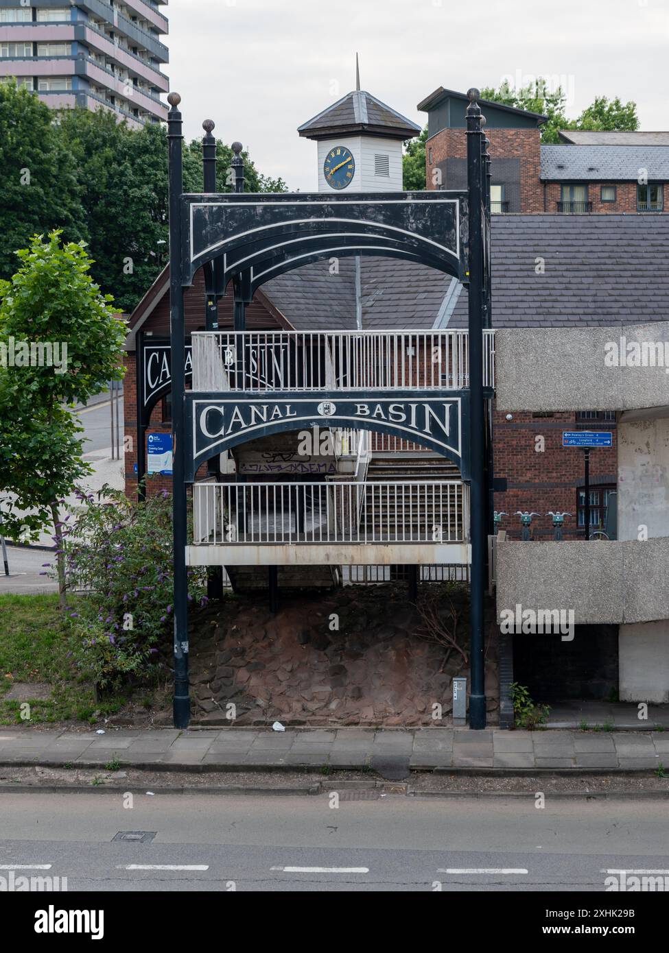 Canal basin sign marking the entrance to a waterway, featuring a clock ...