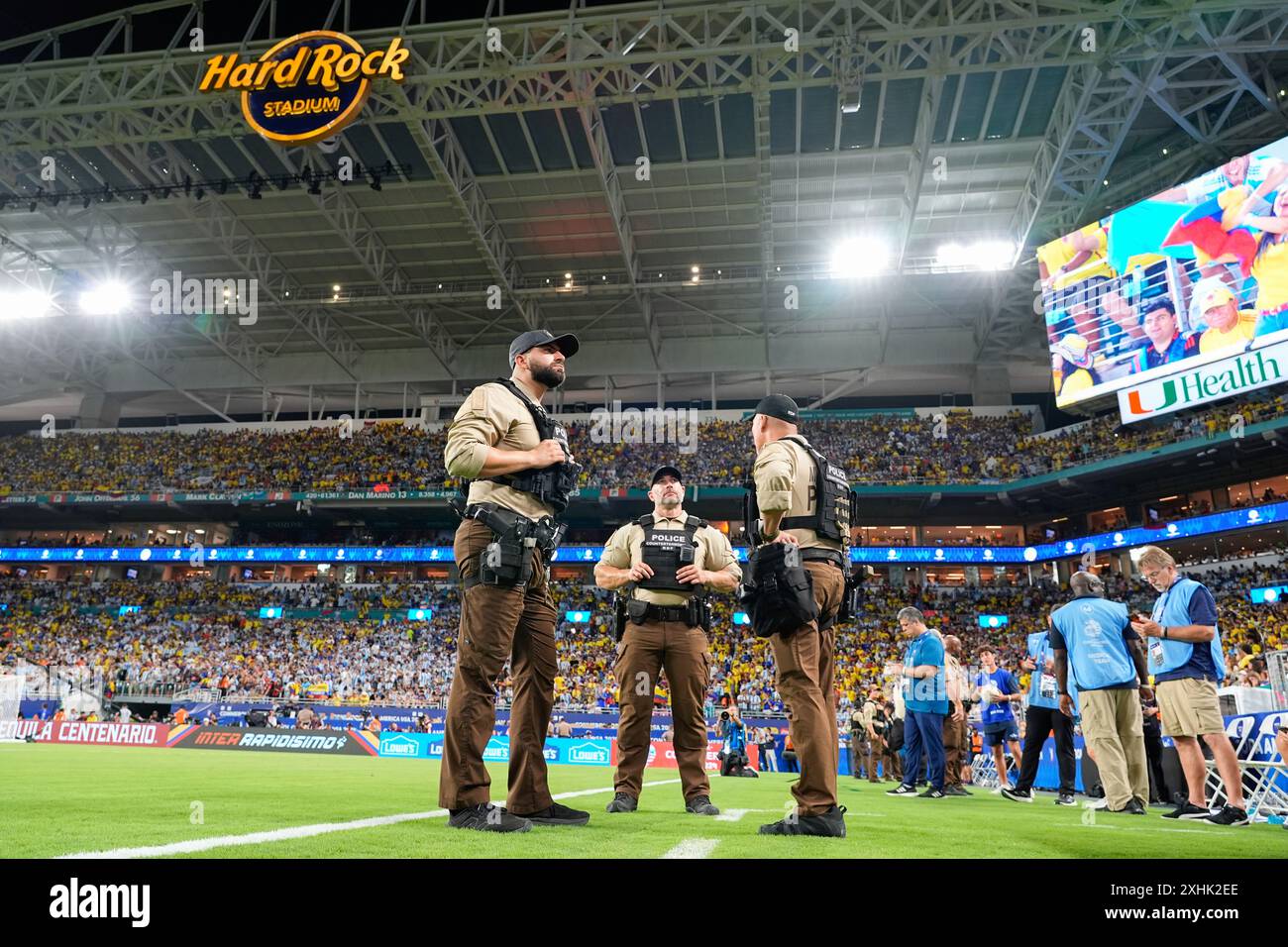 Police officers stand on the side of the field prior to the Copa ...
