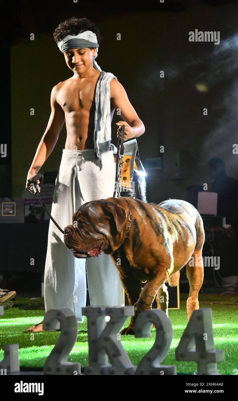 Colombo, Sri Lanka. 14th July, 2024. A boy parades his dog during the ...