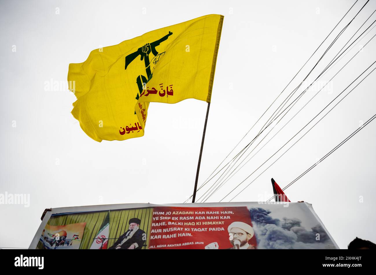 Srinagar, India. 14th July, 2024. A Kashmiri Shia Muslim man waves a ...