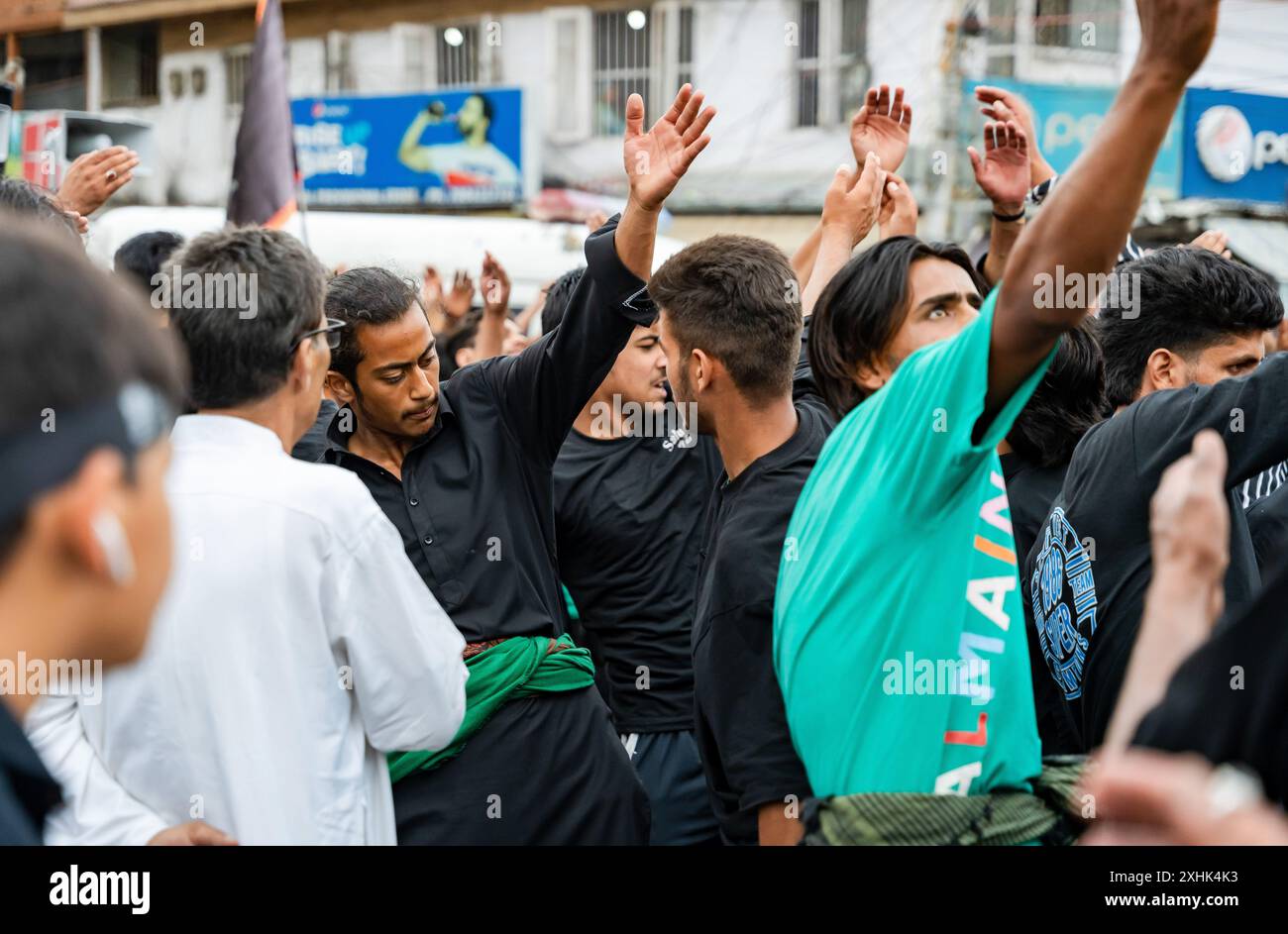 Srinagar, India. 14th July, 2024. Shia Muslims beat their chests and ...