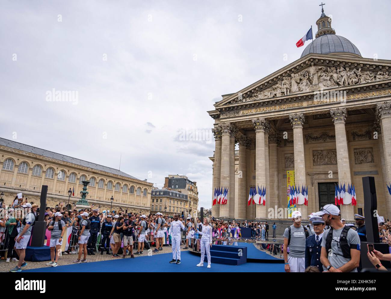 Paris, France. 14th July, 2024. Torch bearer Claudine Laslaz and ...