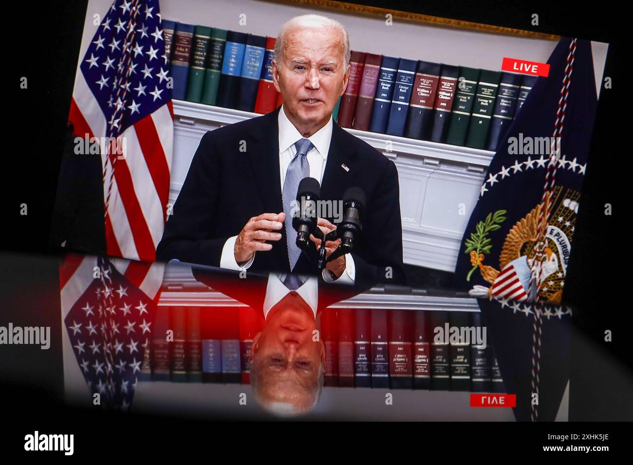 In this photo illustration, a screen shows current US President Joe ...