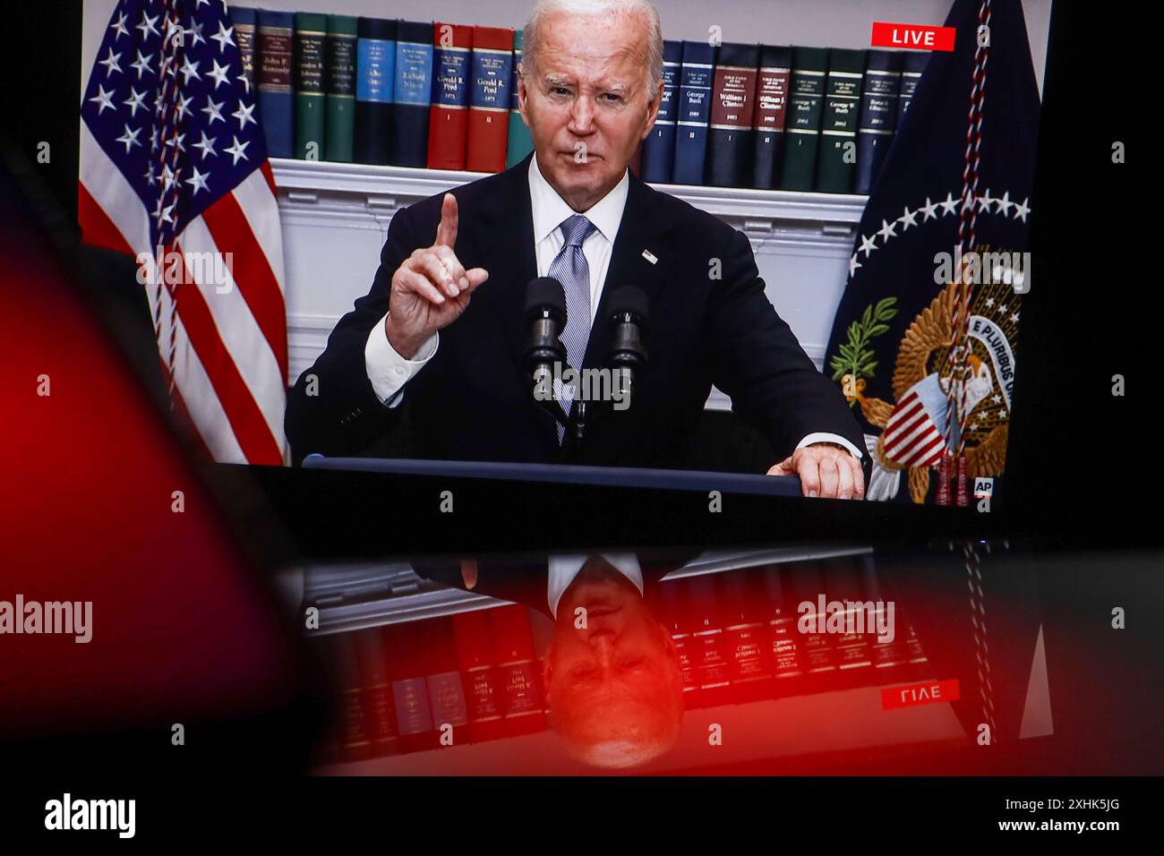 In this photo illustration, a screen shows current US President Joe ...