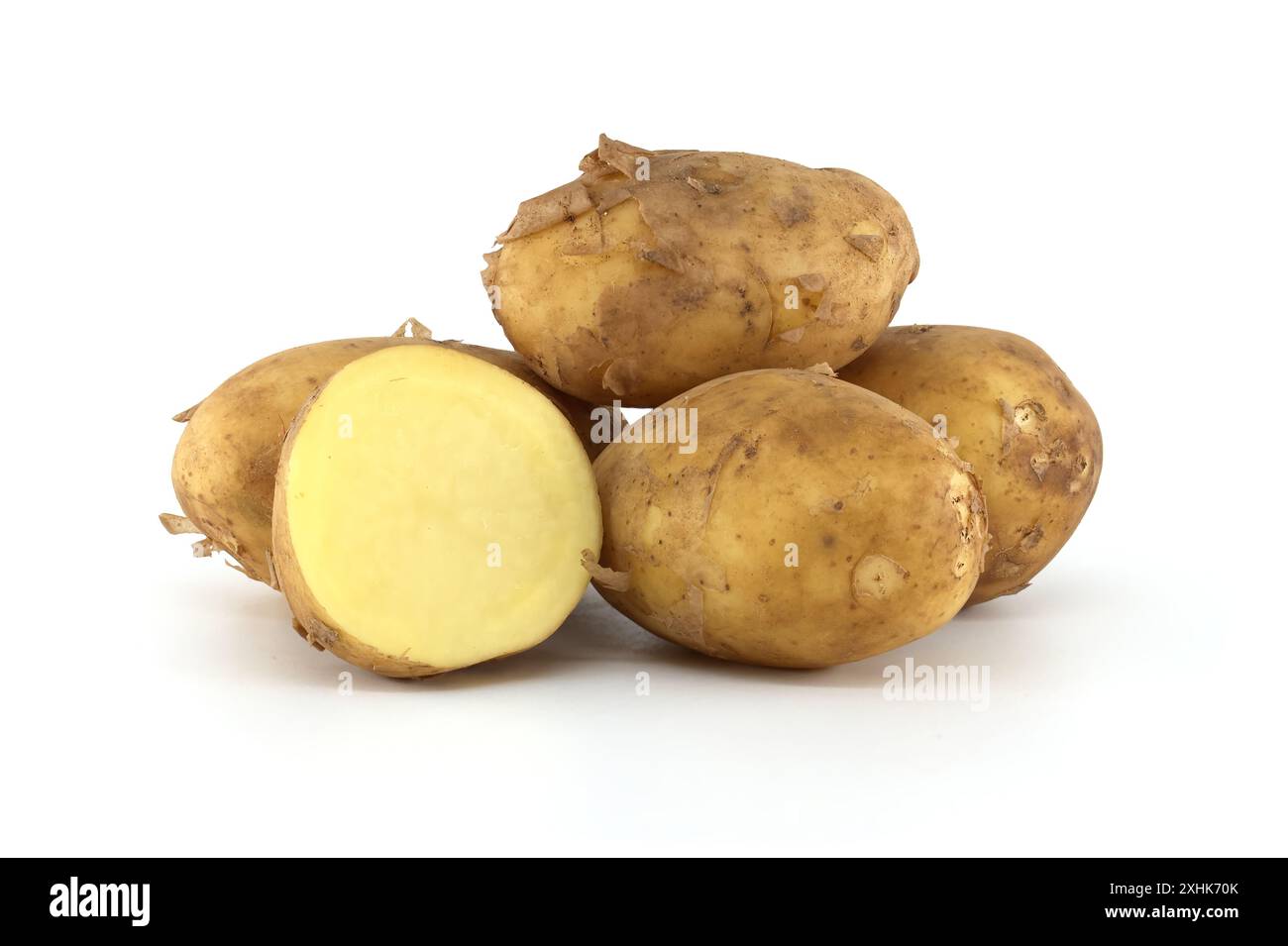 Pile of recent harvest early season potatoes isolated on a white ...