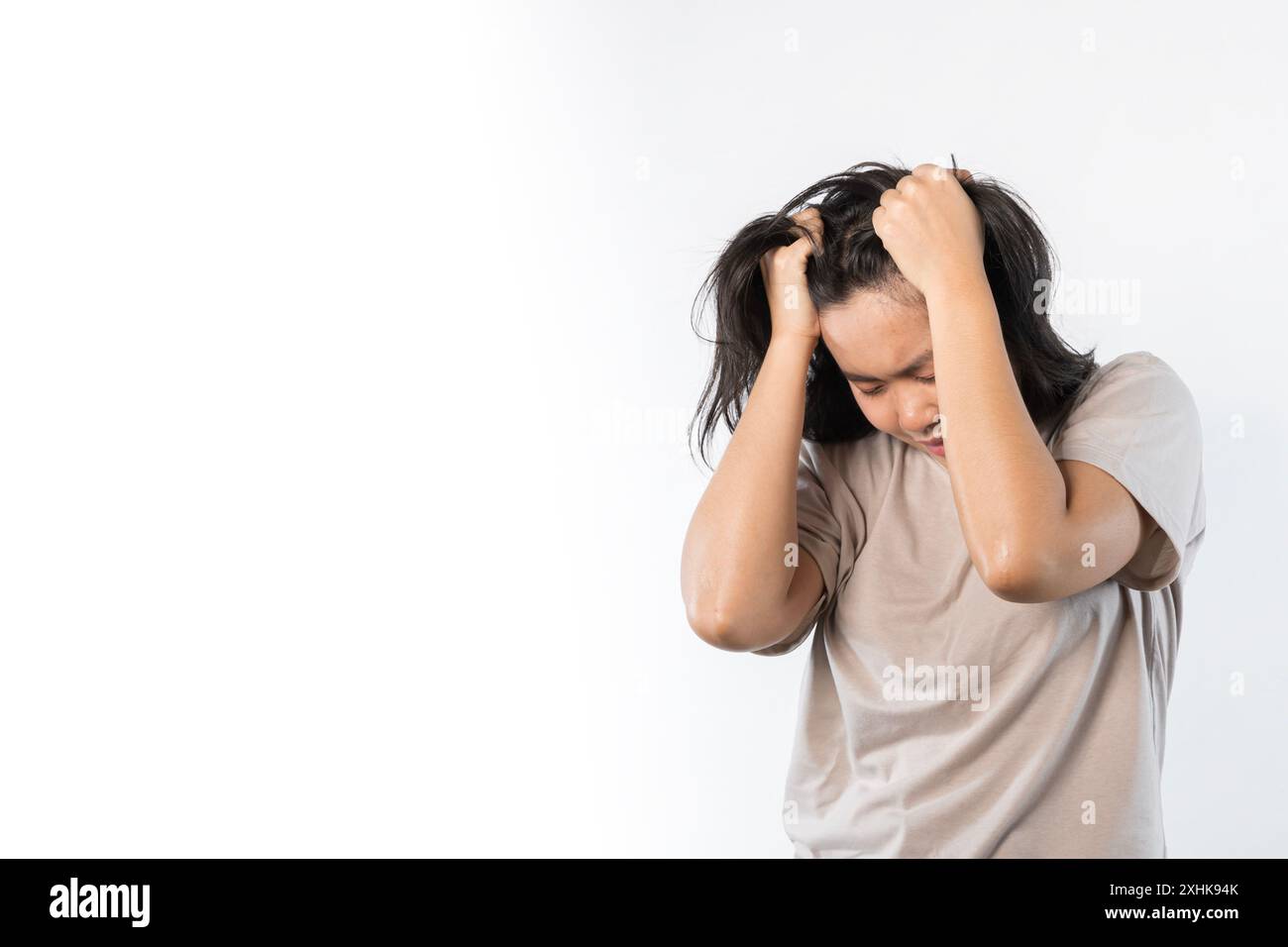 Young asian woman hand touching head she's feeling depressed stress ...
