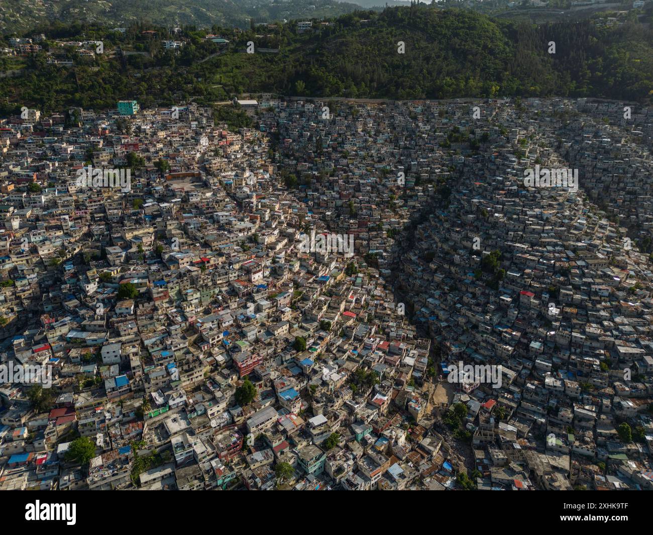 FILE - Houses blanket the slopes of the Jalousie neighborhood of Port-au-Prince, Haiti, May 13 ...