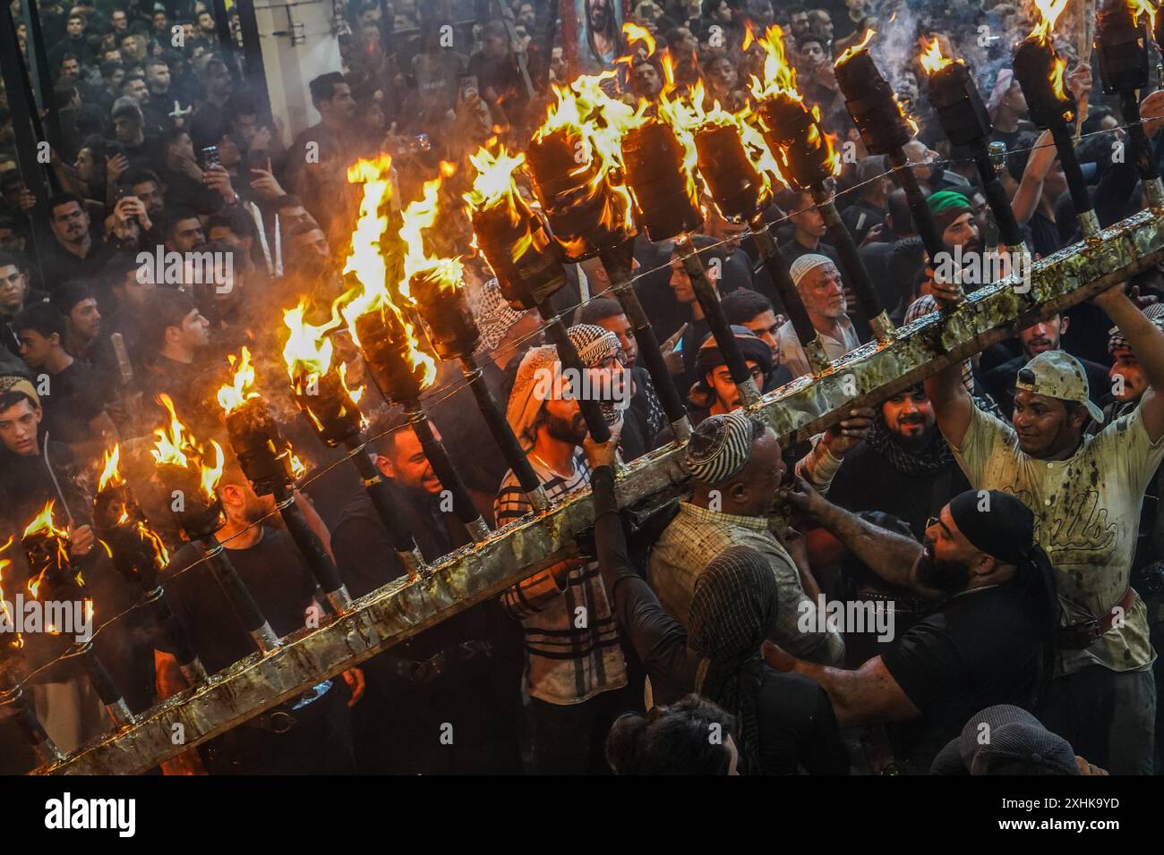 Najaf, Iraq. 14th July, 2024. Shiite Muslims perform mourning rituals ...