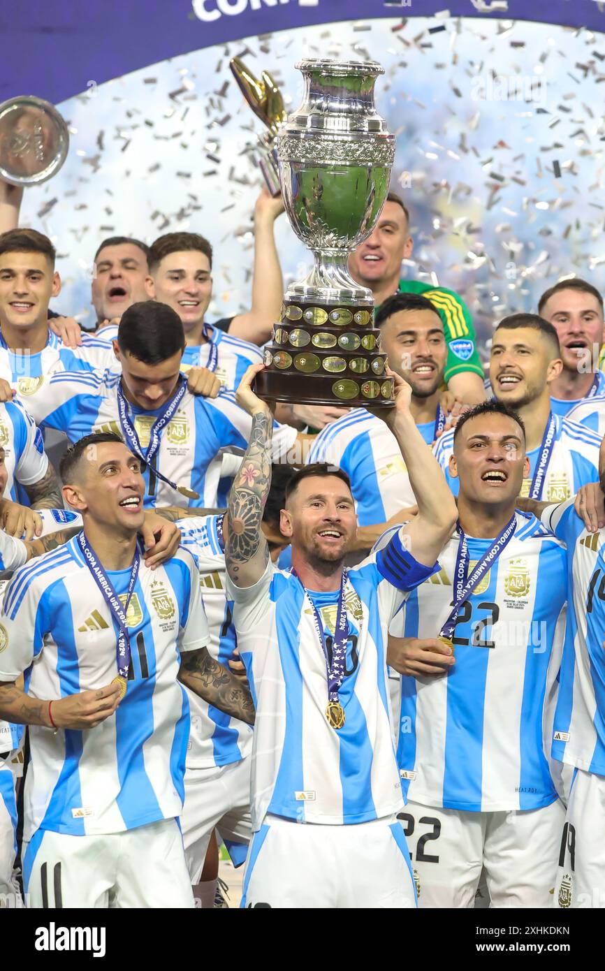 Miami, United States. 15th July, 2024. Lionel Messi lifts up the trophy ...