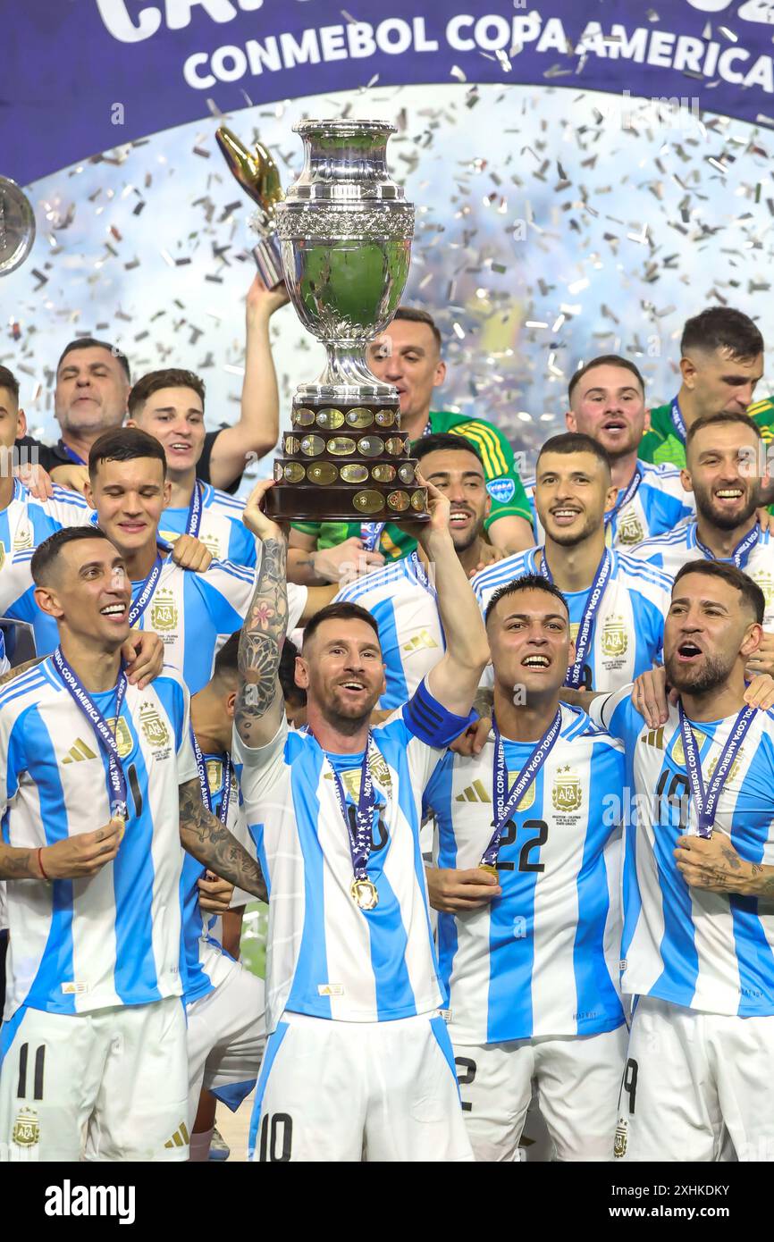 Miami, United States. 15th July, 2024. Lionel Messi lifts up the trophy ...