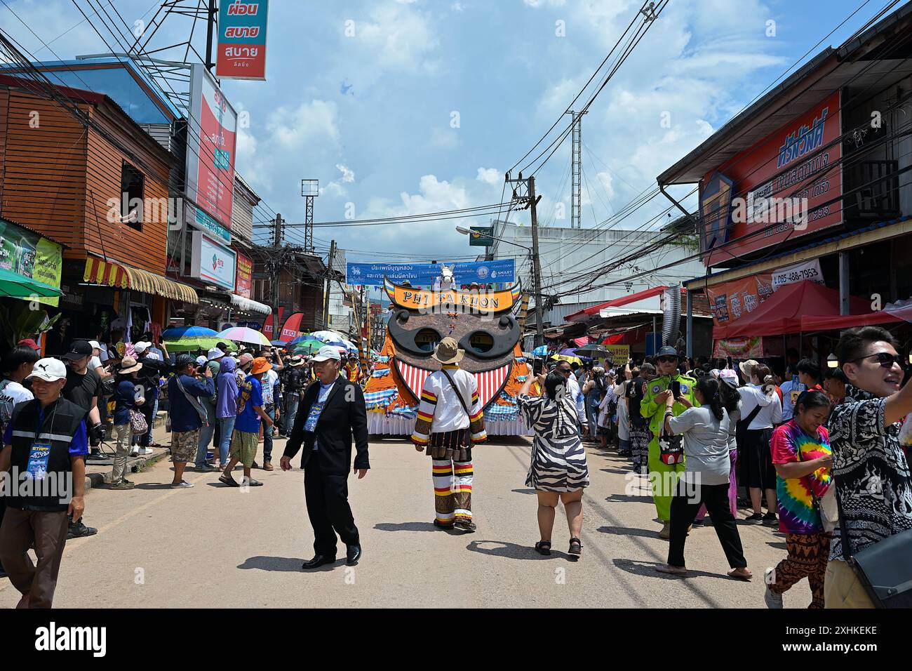 A colorful float decorated with a 'ghost' mask making its way along the ...