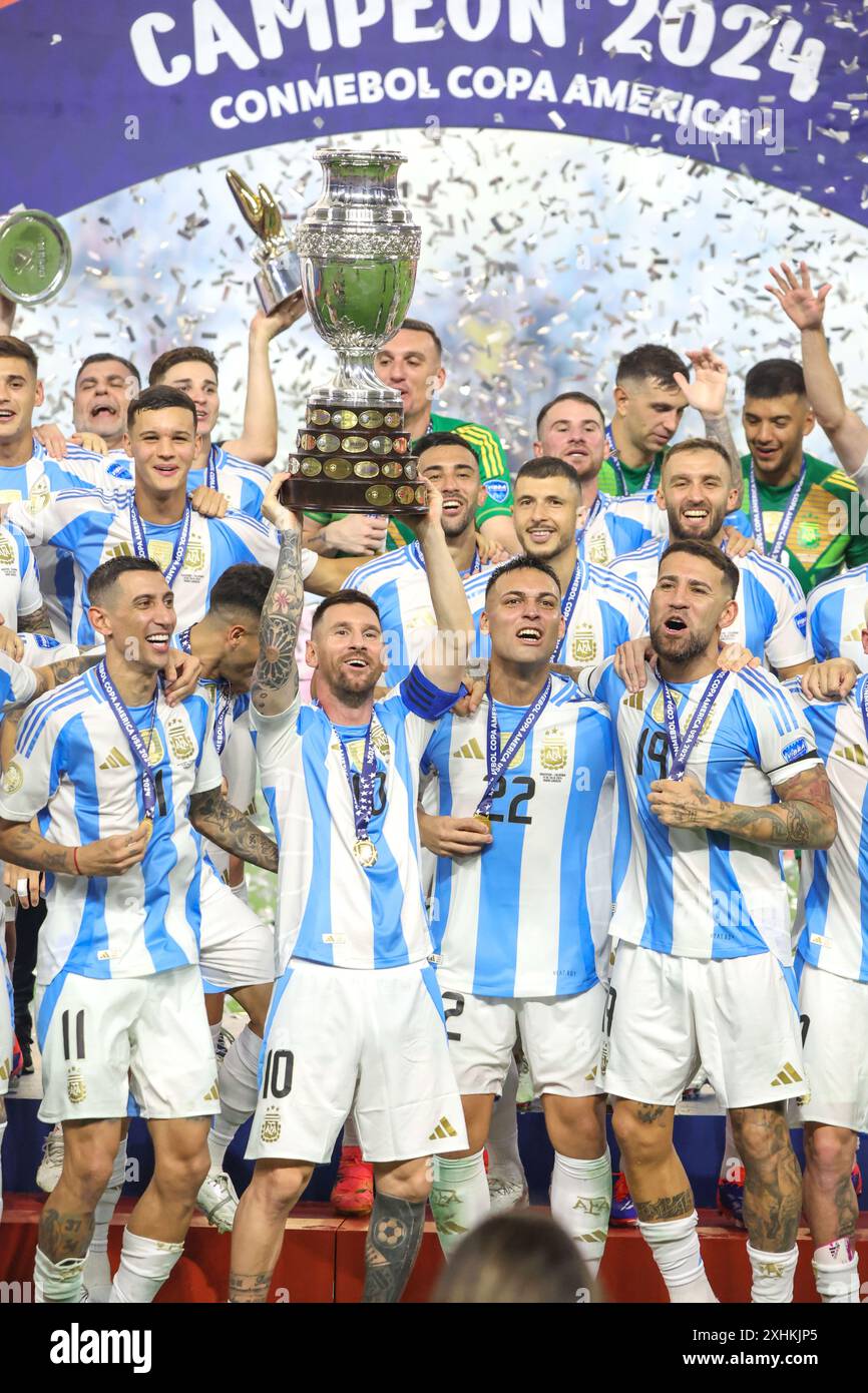 Miami, United States. 15th July, 2024. Lionel Messi lifts up the trophy ...