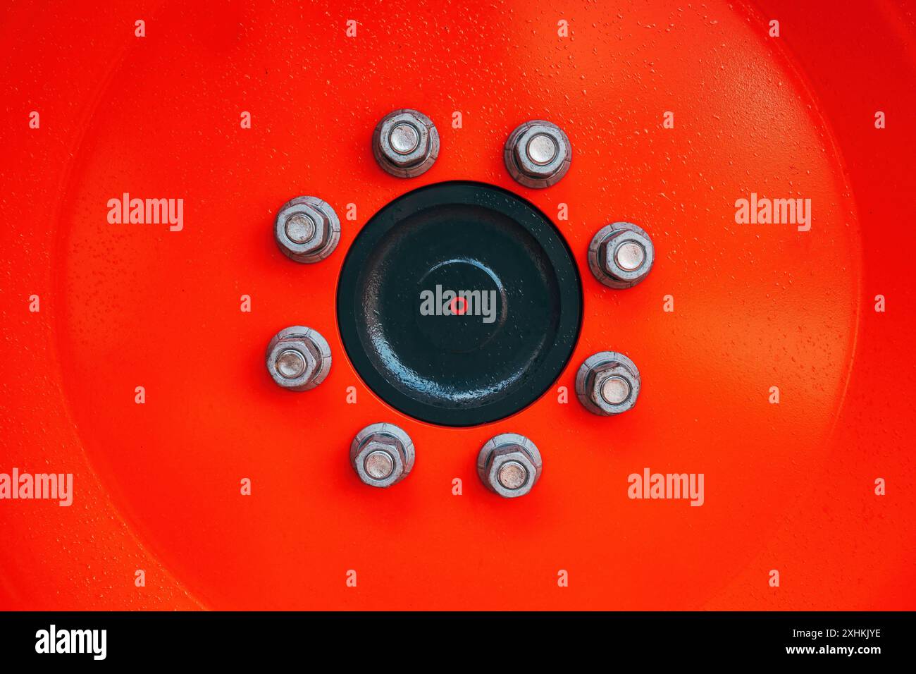 Tractor wheel rim with lock nuts as background Stock Photo - Alamy