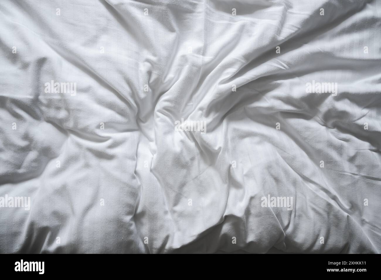 Crumpled and wrinkled white bed sheet, top view as background Stock ...
