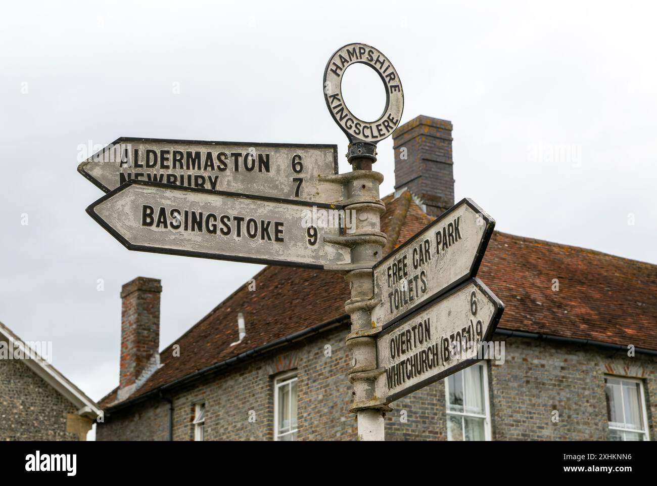 Road signpost arrow pointers and distances to nearby settlements ...