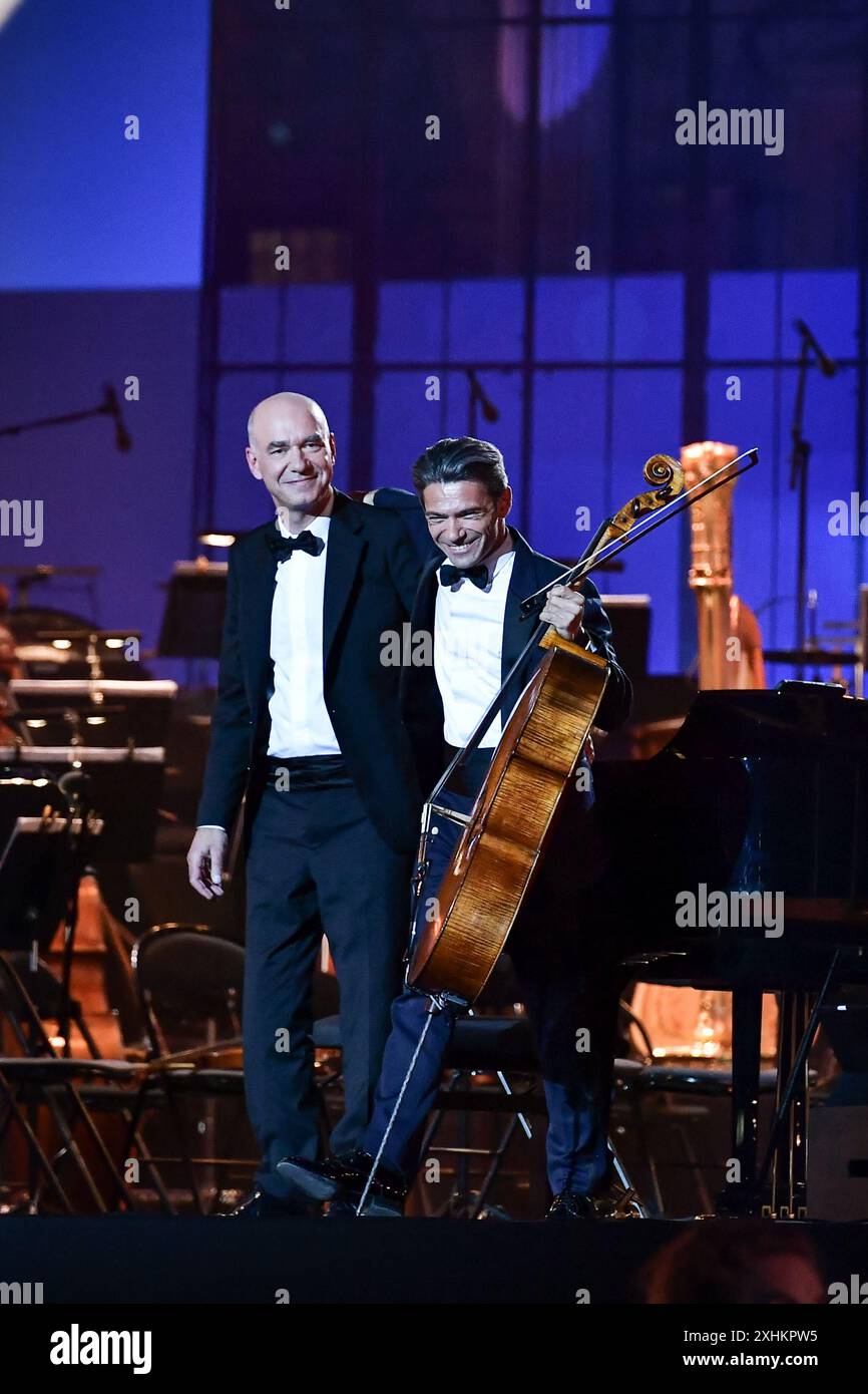 French cellist Gautier Capucon embraces the audience before the arrival ...