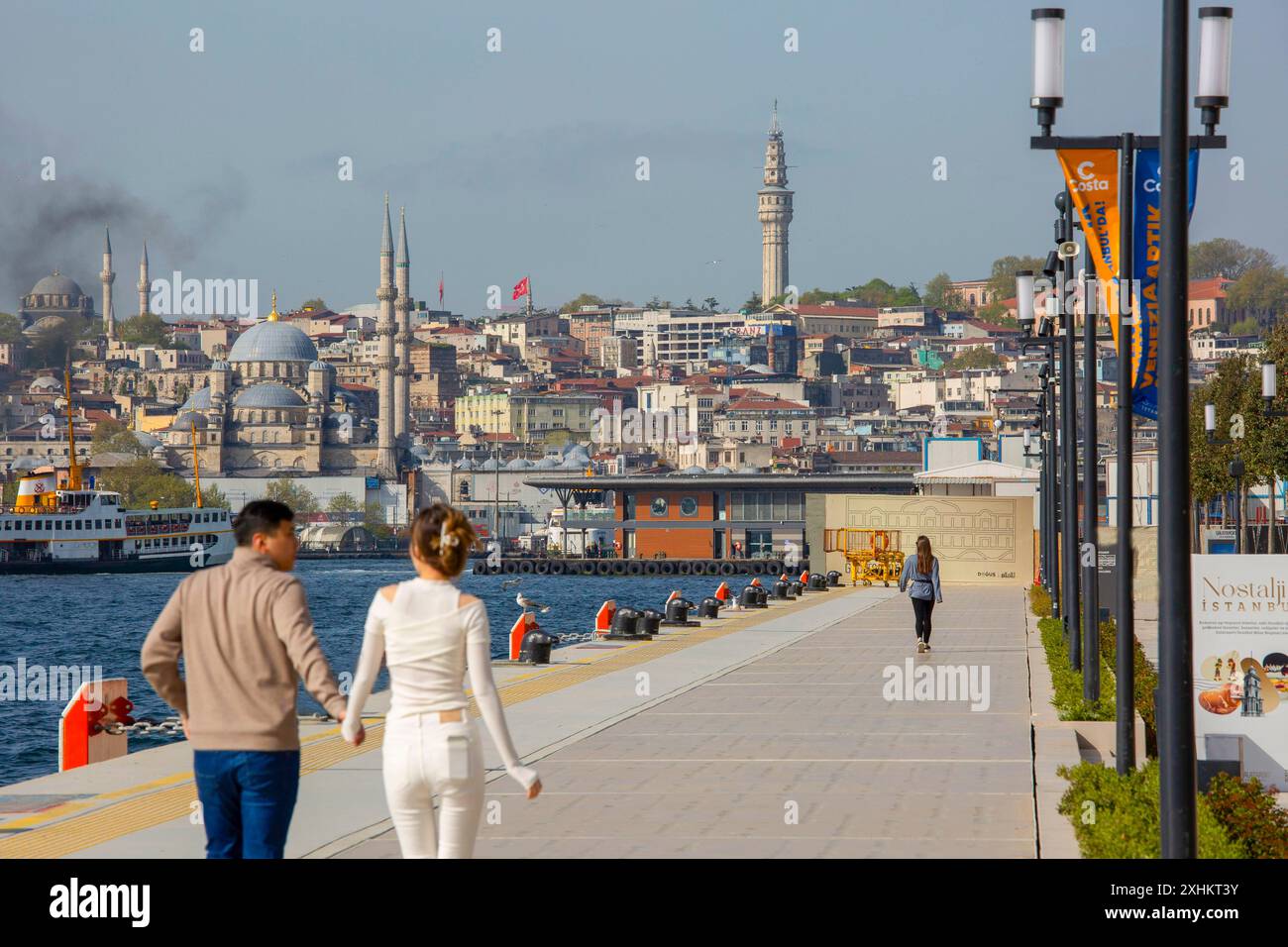 Turkey, Istanbul, Galataport, young couple strolling on the Galataport ...