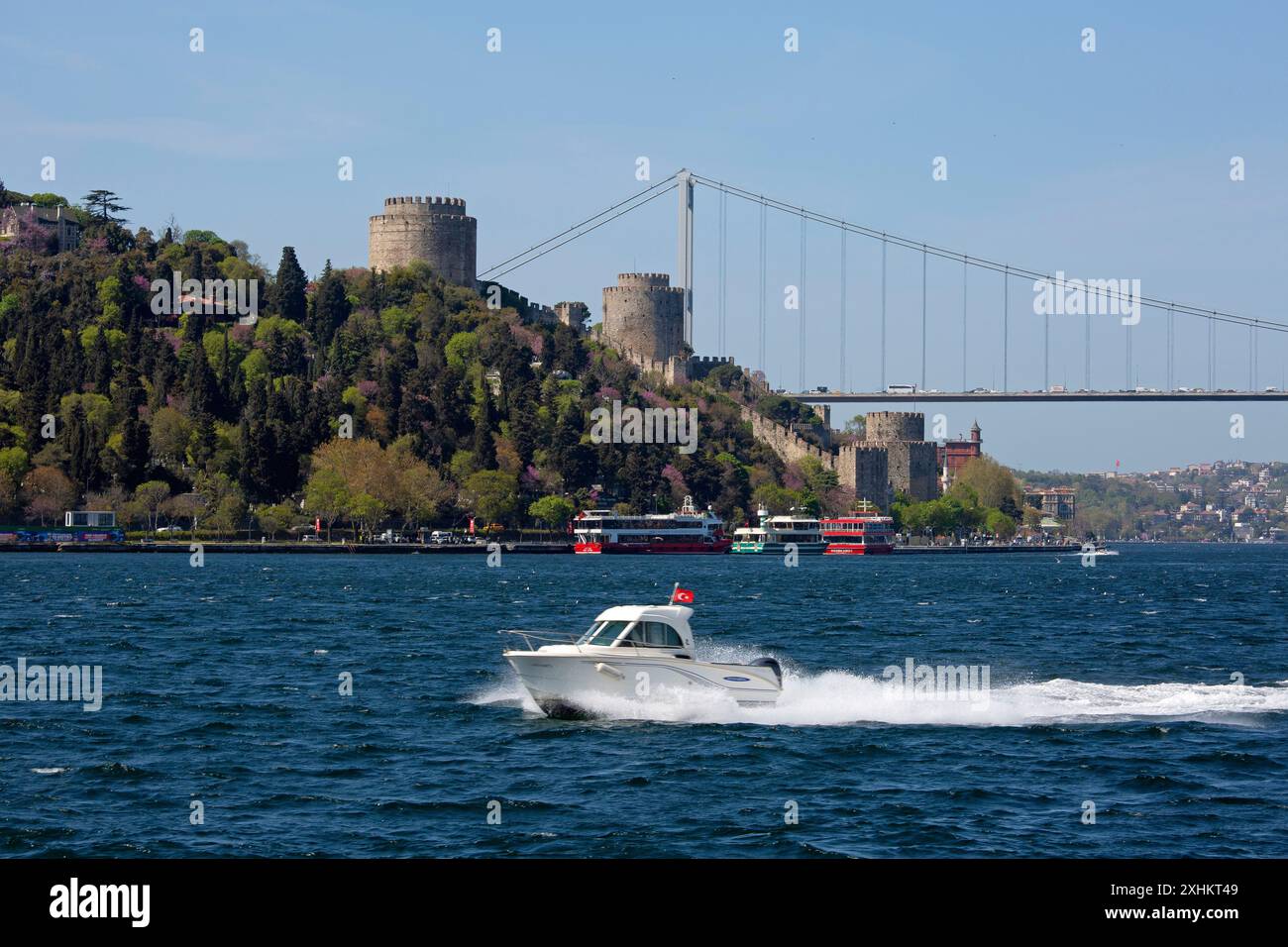 Turkey, Istanbul, small pleasure boat speeding along the Bosphorus in ...