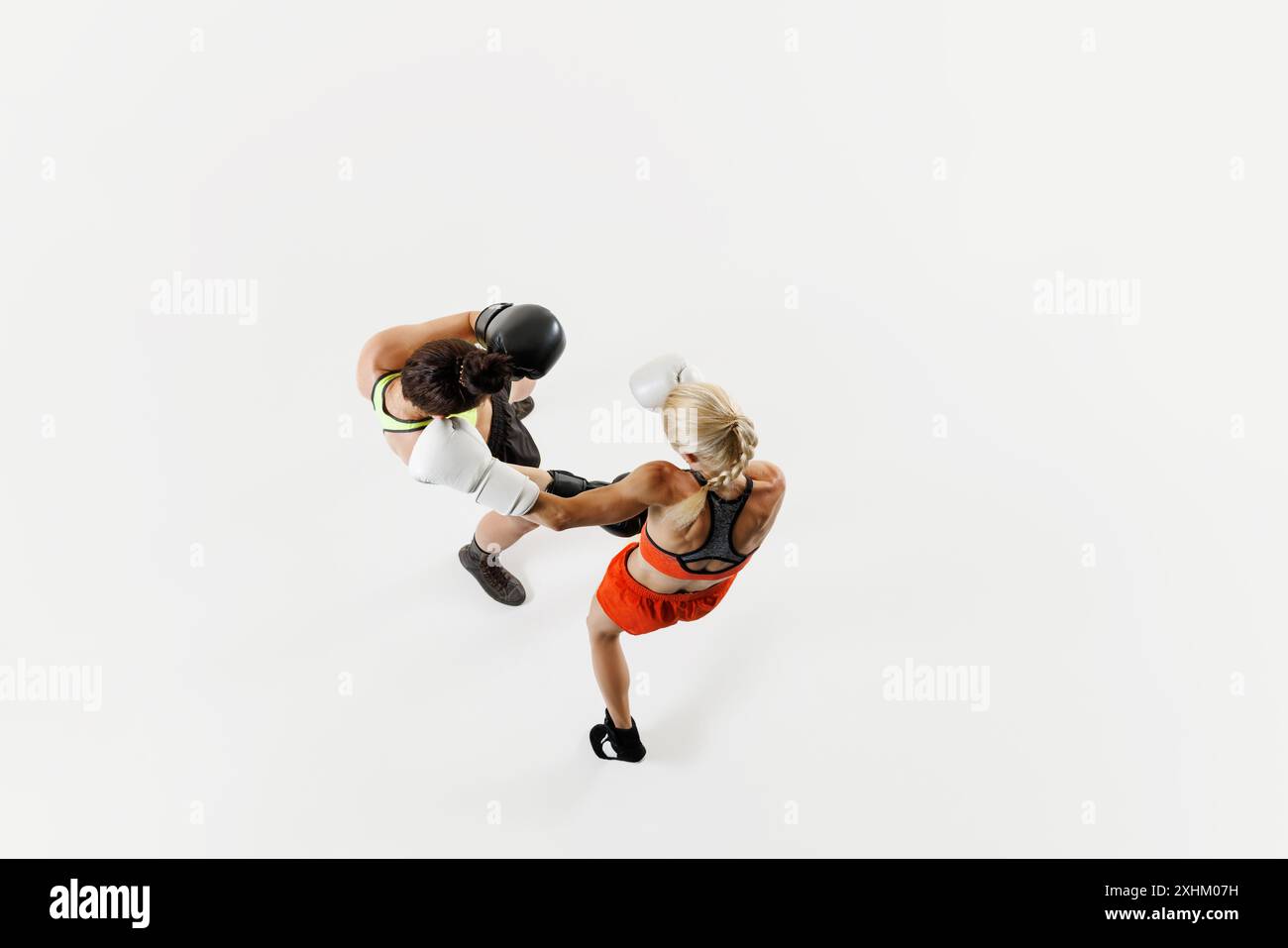 Top view of two competitive and focused women, boxing athletes in ...