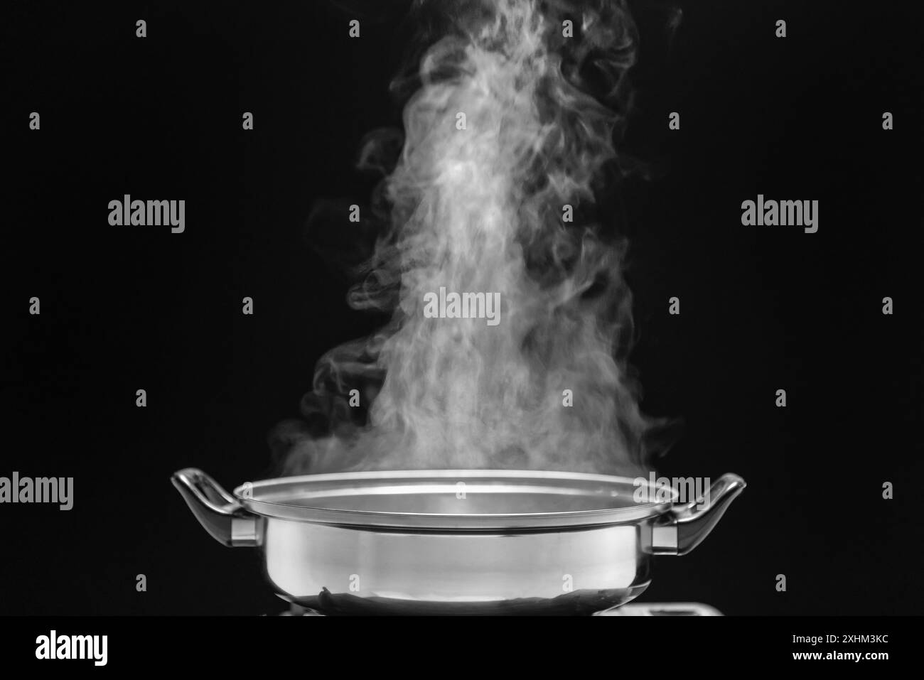 Pot steaming on hot stove Black and White Stock Photos & Images - Alamy