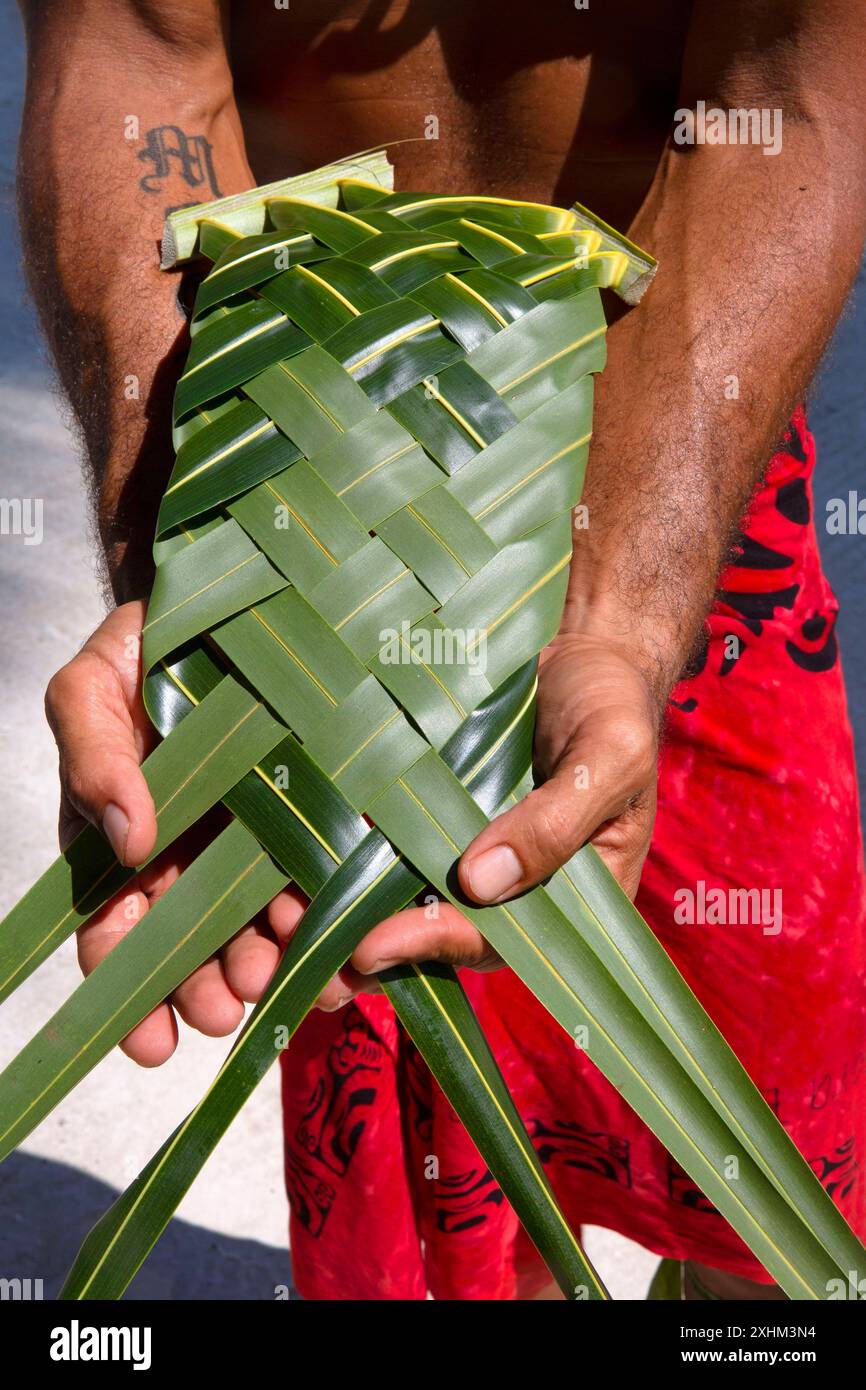 French Polynesia, Bora Bora island, Rosto, Polynesian guide making a ...