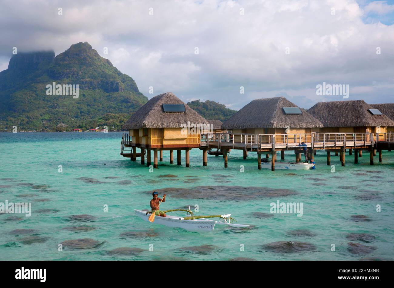 French Polynesia, Bora Bora island, Polynesian in his va'a, Polynesian ...