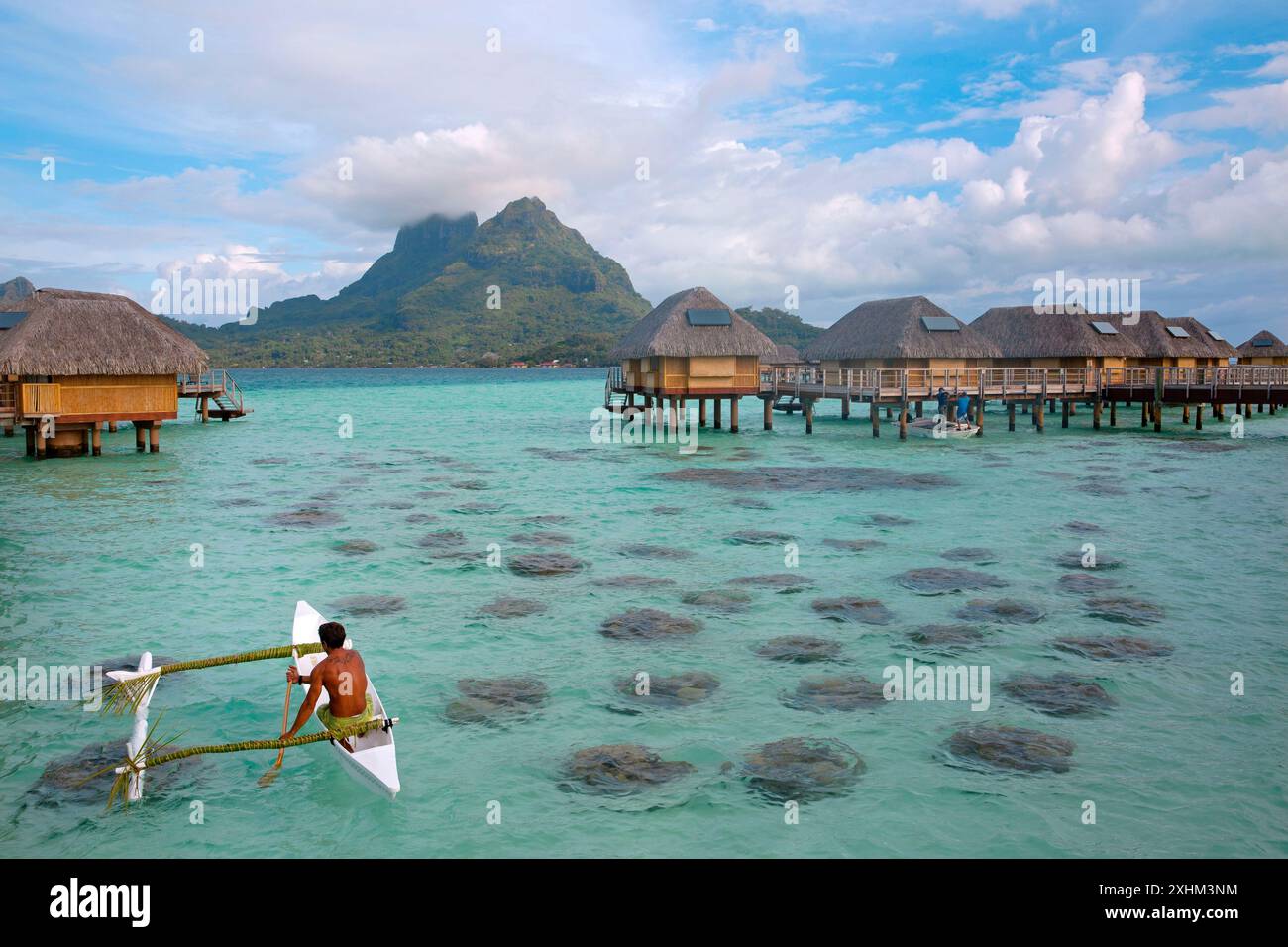 French Polynesia, Bora Bora island, Polynesian in his va'a, Polynesian ...