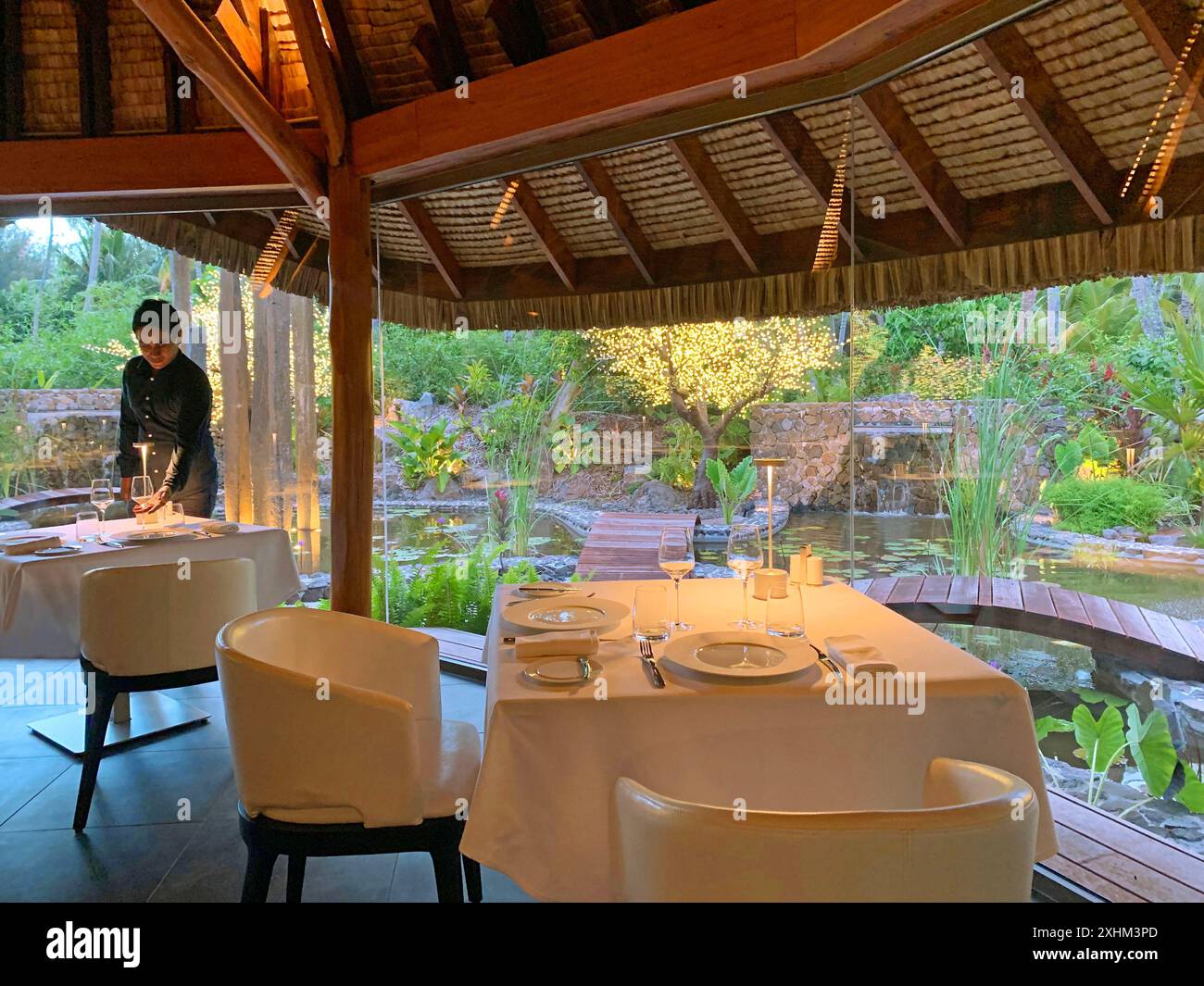 French Polynesia, Bora Bora island, waiter under the Poerava pavilion ...